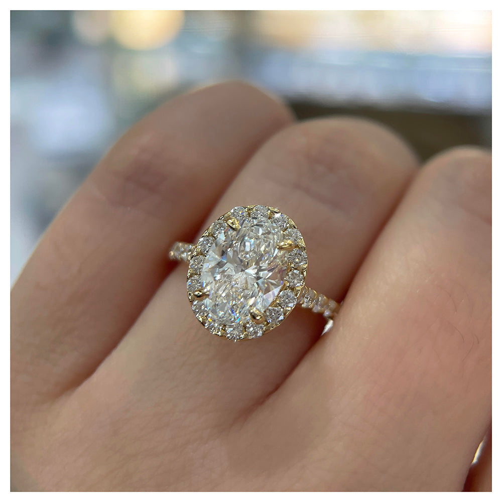 2 ct Oval Lab-Grown Diamond on a 18k yellow gold halo side-diamond ...